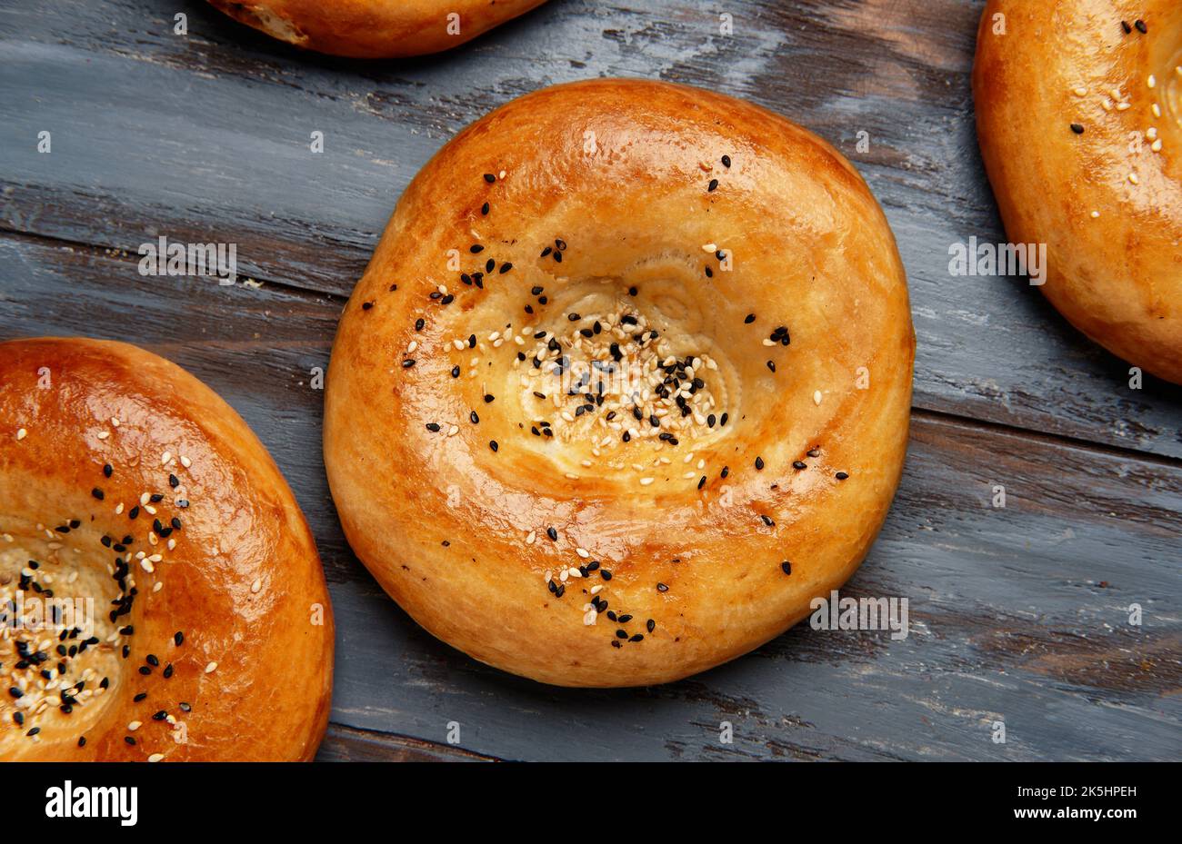 National uzbek bread on wood background. Traditional food Stock Photo ...
