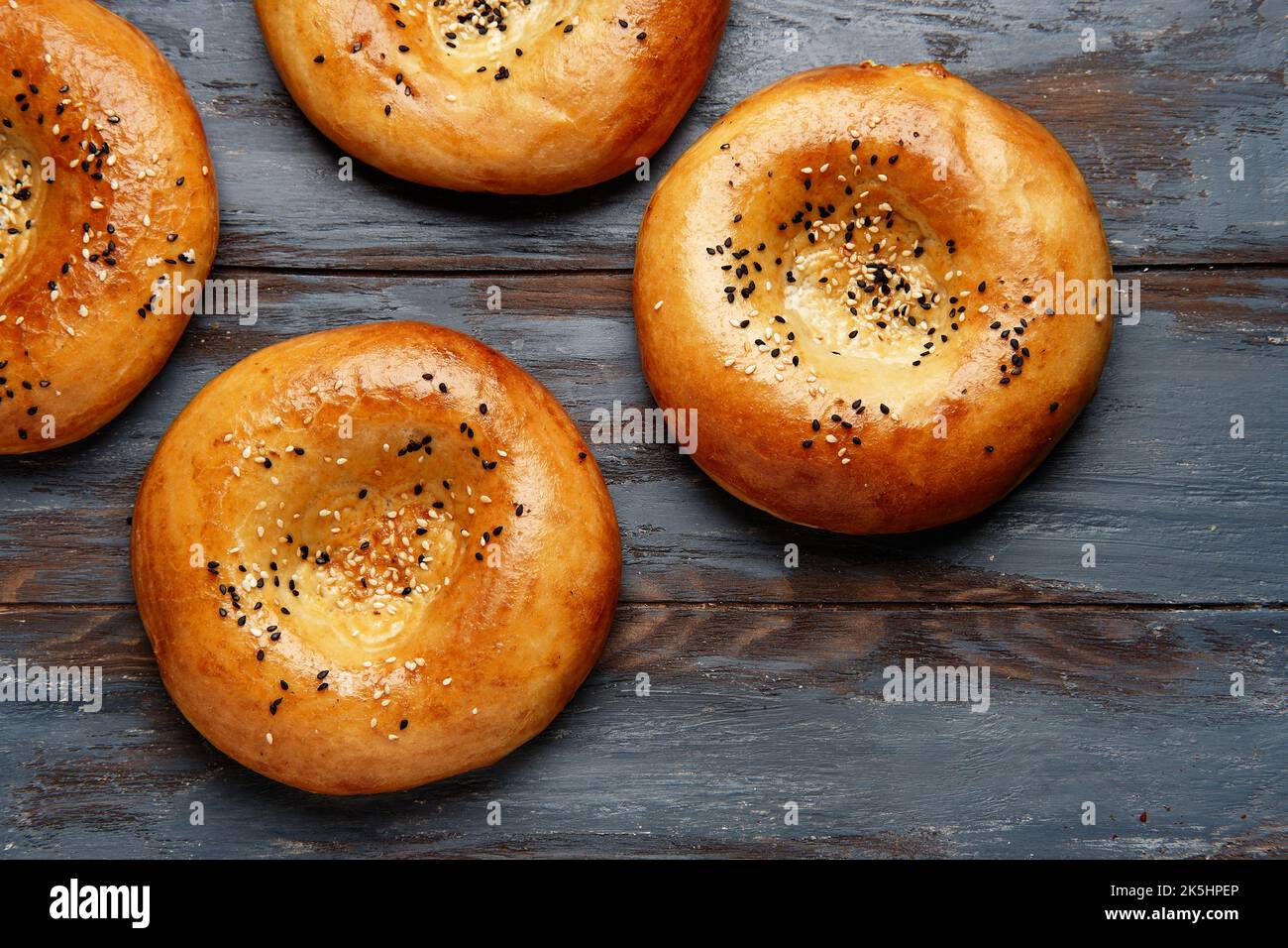 National uzbek bread on wood background. Traditional food Stock Photo ...