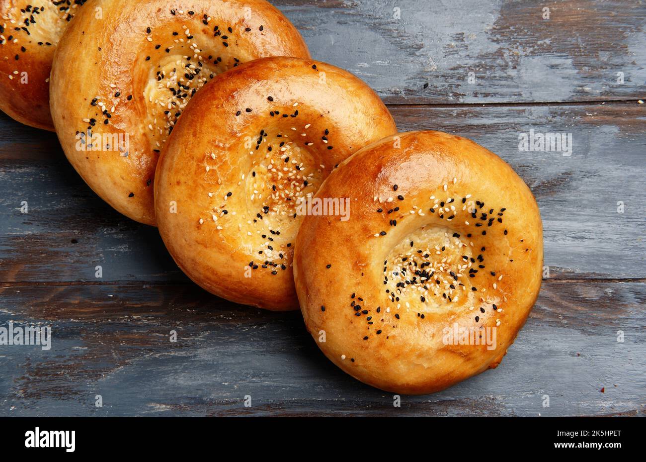 National uzbek bread on wood background. Traditional food Stock Photo ...