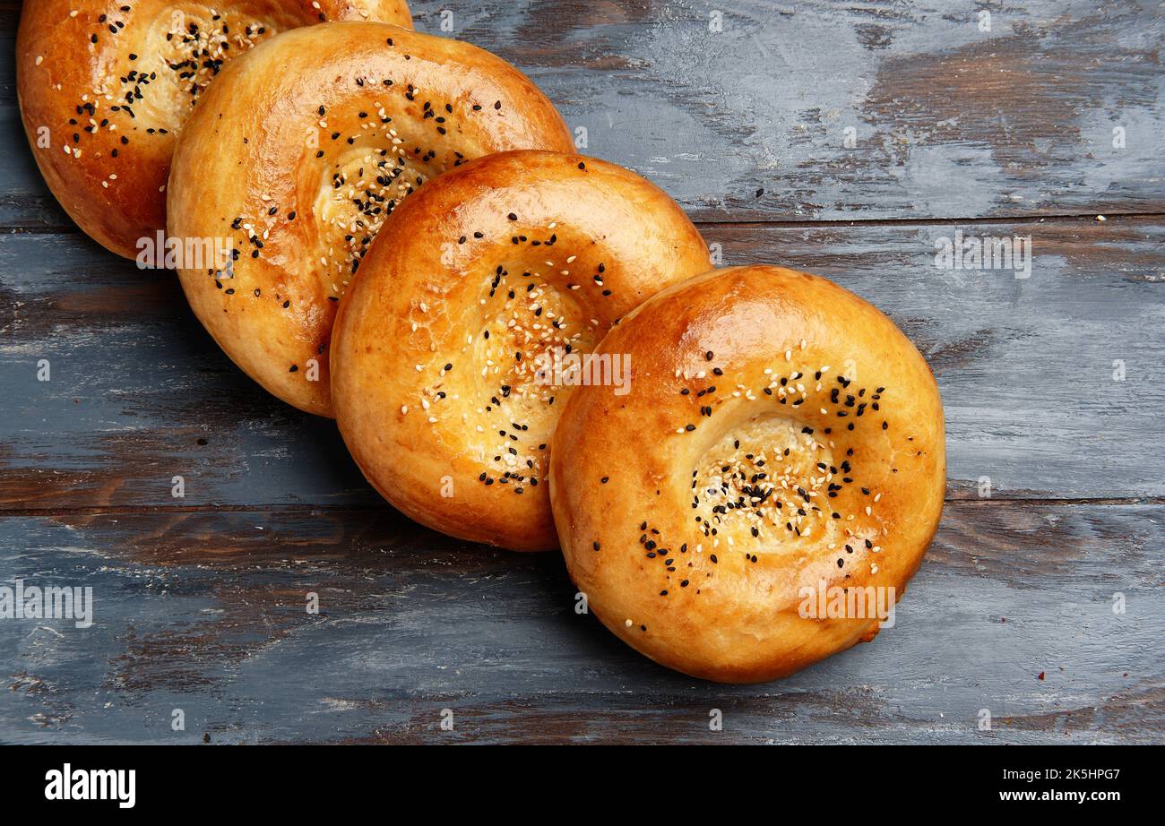 National uzbek bread on wood background. Traditional food Stock Photo ...