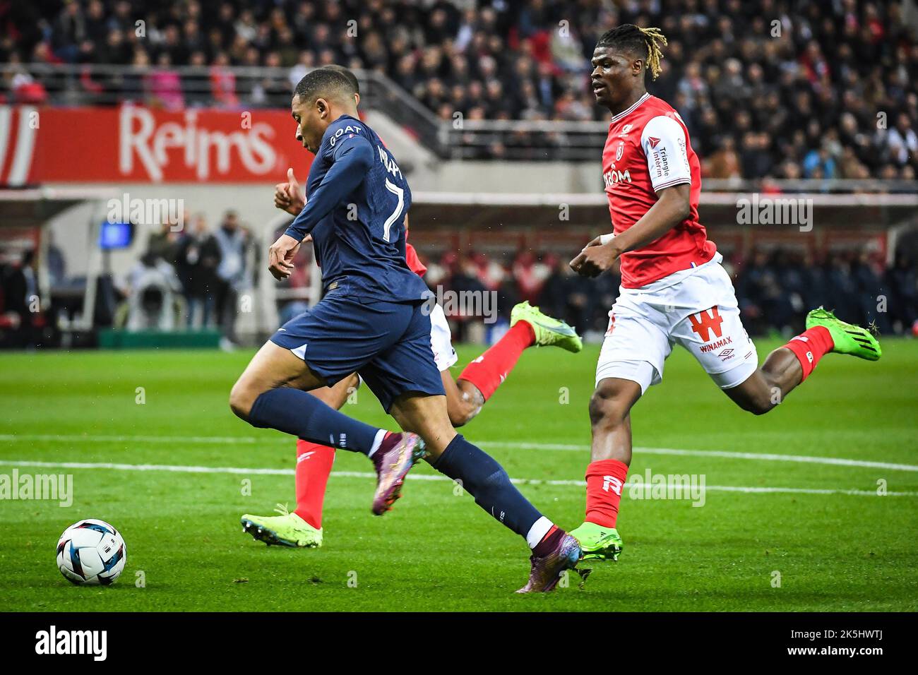 Kylian MBAPPE of PSG and Emmanuel AGBADOU of Reims during the French ...