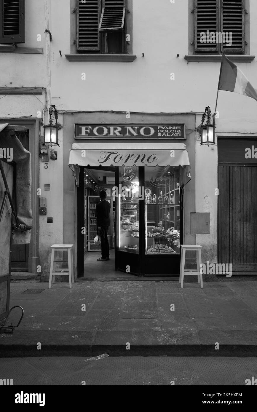 A vertical of a typical bakery in Florence, Italy in black and white ...