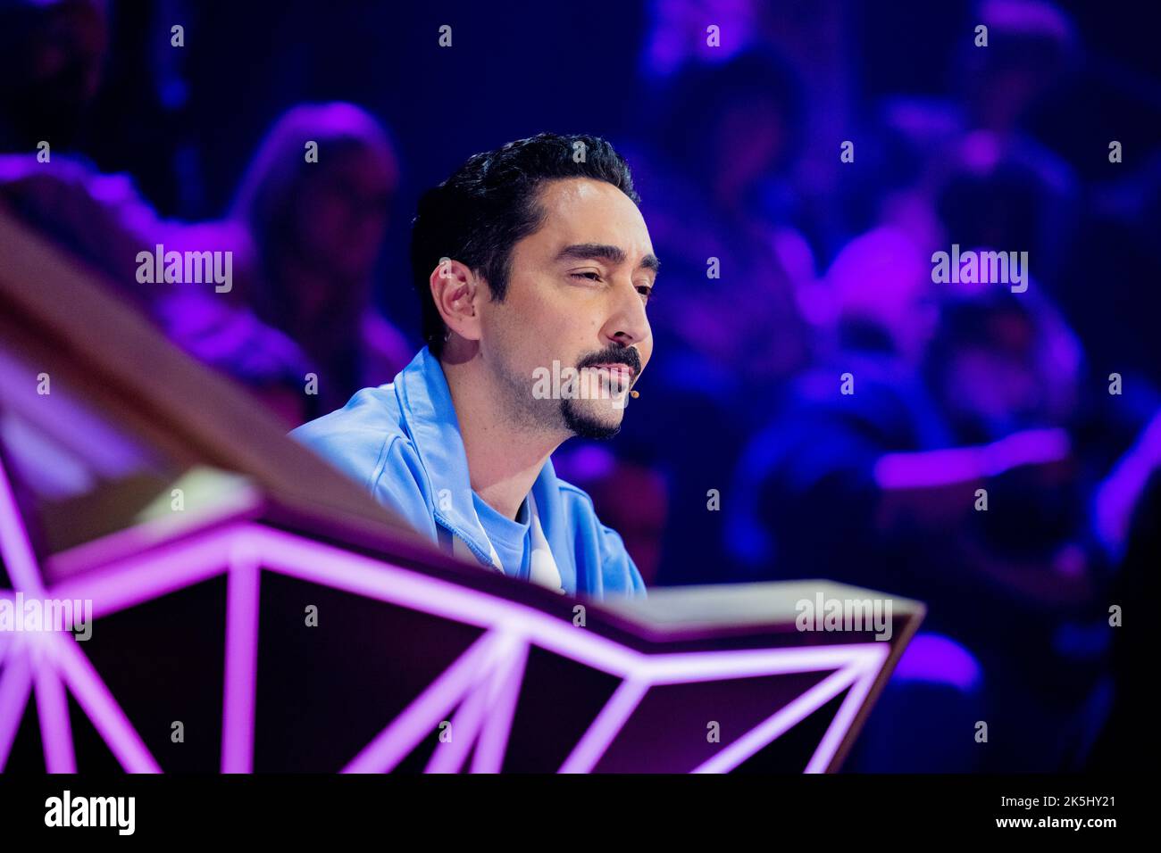 Cologne, Germany. 08th Oct, 2022. Eko Fresh from the guessing team sits ...