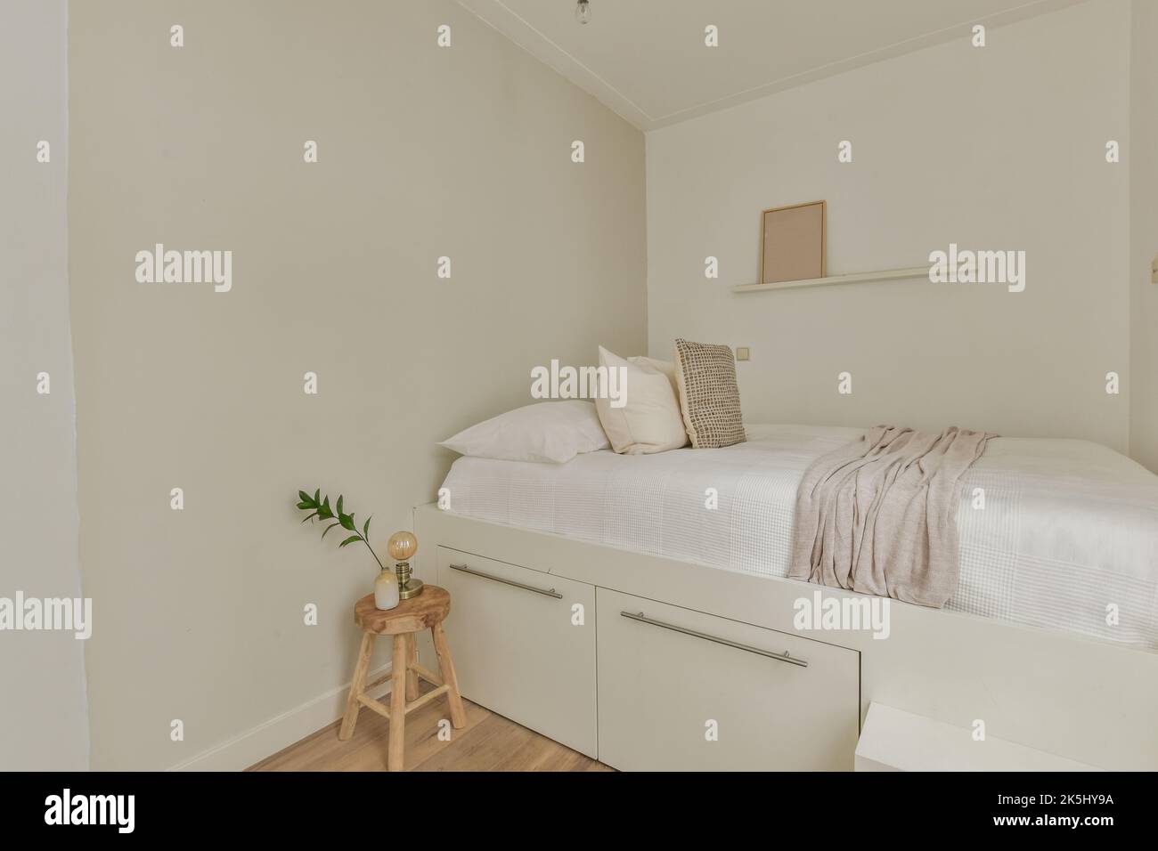 Table with chairs and flowers located near lounge area and kitchen in ...