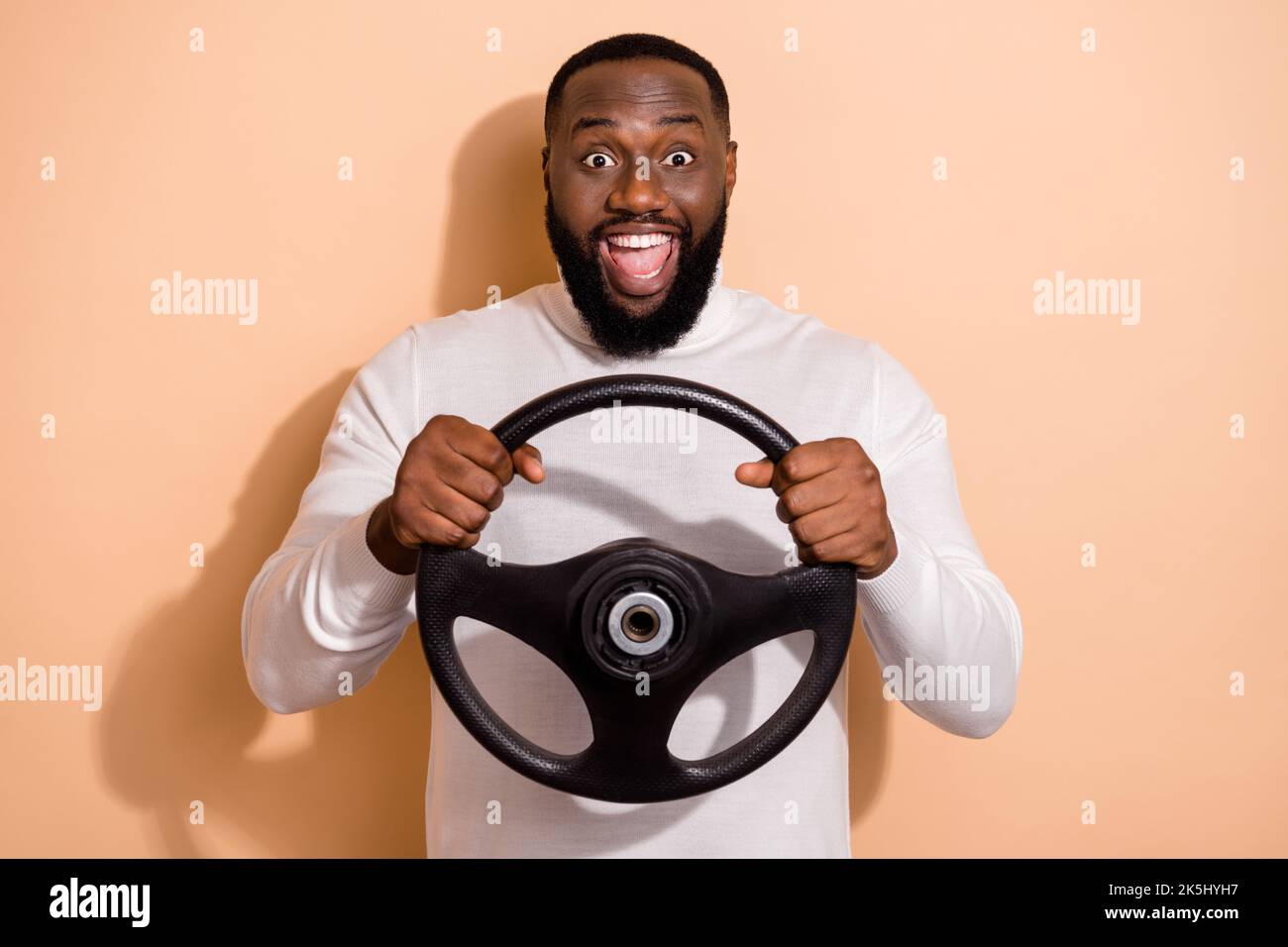 Photo of impressed funky guy wear white sweater vehicle rider open ...