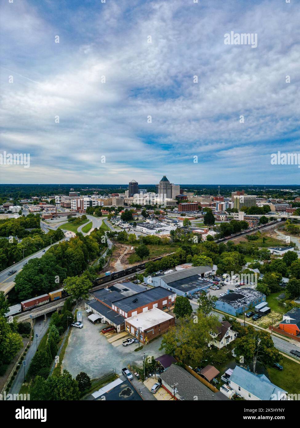A vertical shot of the cityscape in Greensboro with buildings ...