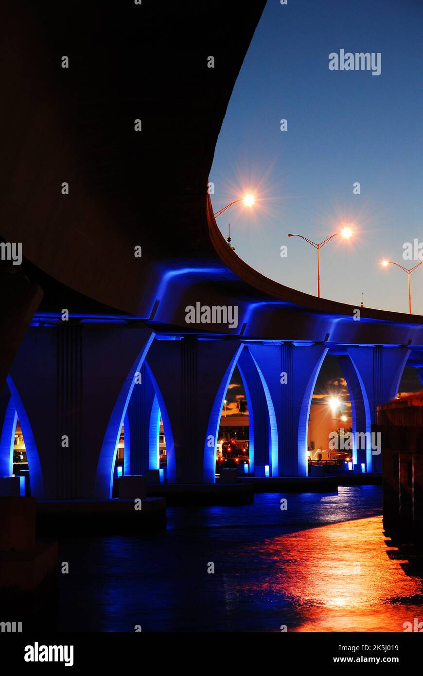 The Miami Port Bridge is illuminated with blue light at night Stock ...