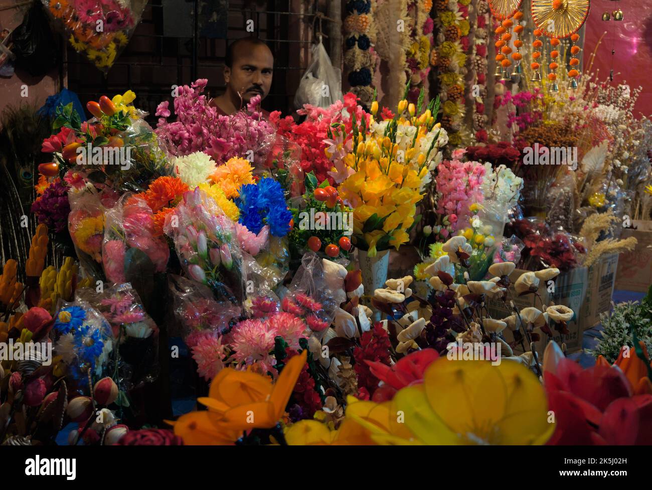 Roadside seller selling decorative items in temporary pavement stalls ...