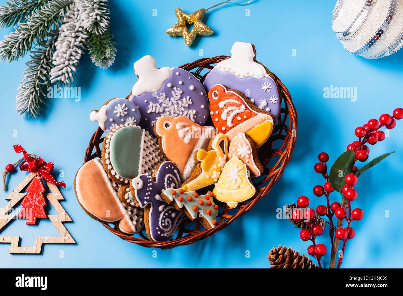Christmas Gingerbread on blue background. Flat lay.Snowflake, spruce ...