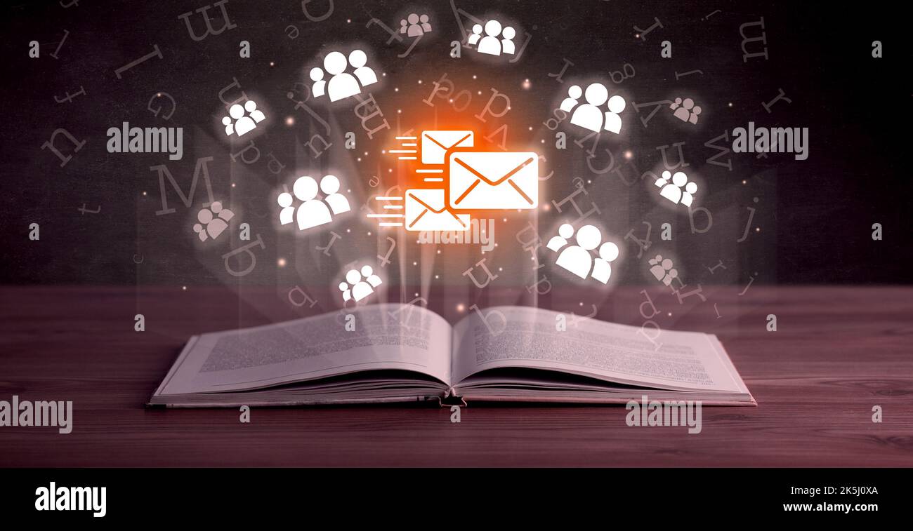 Open book with social networking icons above Stock Photo - Alamy