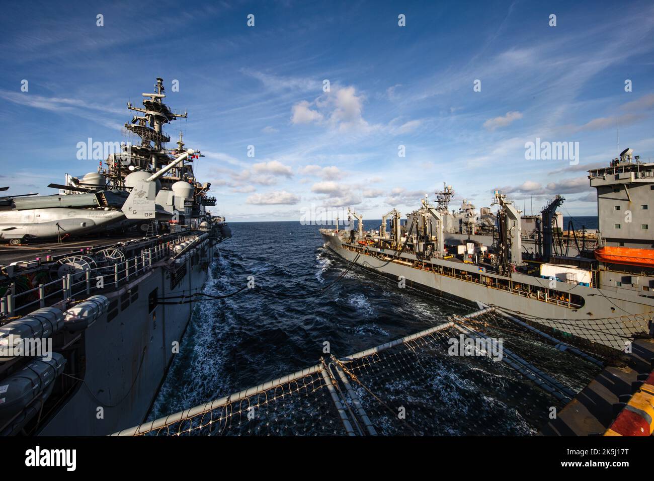 The Wasp-class amphibious assault ship USS Kearsarge (LHD 3), left, and ...