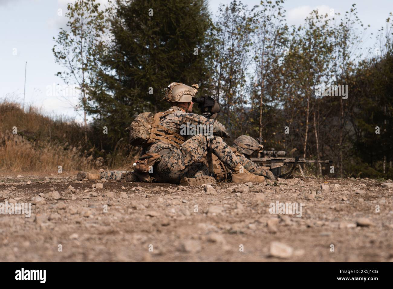 U.S. Marine Corps Sgt. Ryan Lauritsen (right) and Cpl. Jack Secrest ...