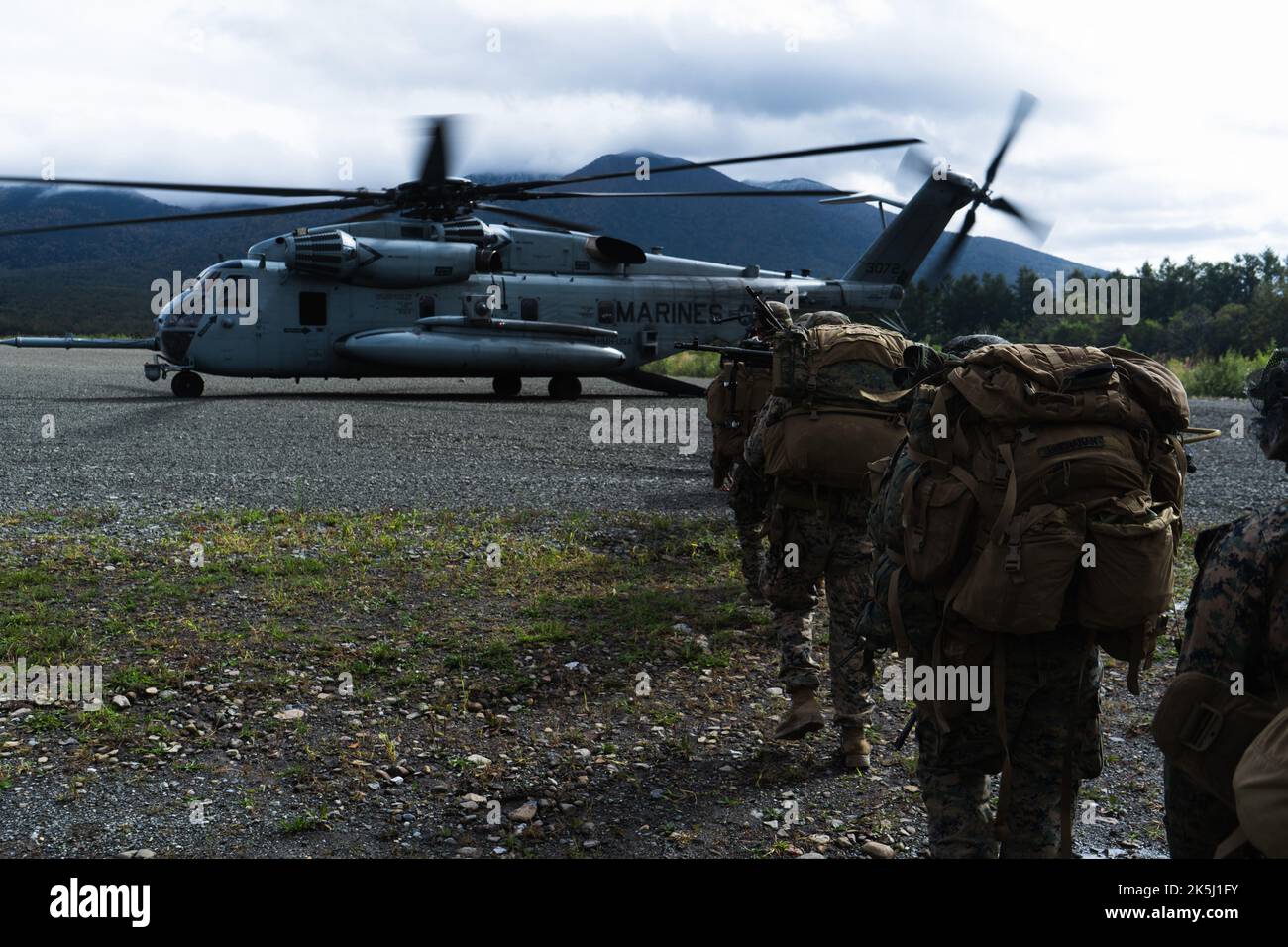 U.S. Marines with 3d Battalion, 3d Marines, 3d Marine Division, load a ...