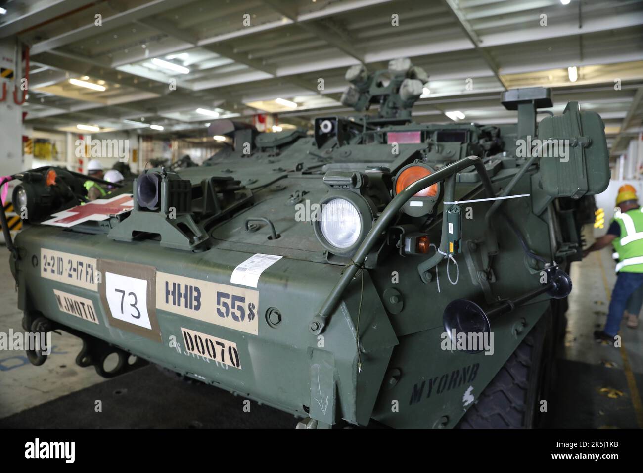 A Stryker combat vehicle is staged staged aboard the Liberty Passion at ...