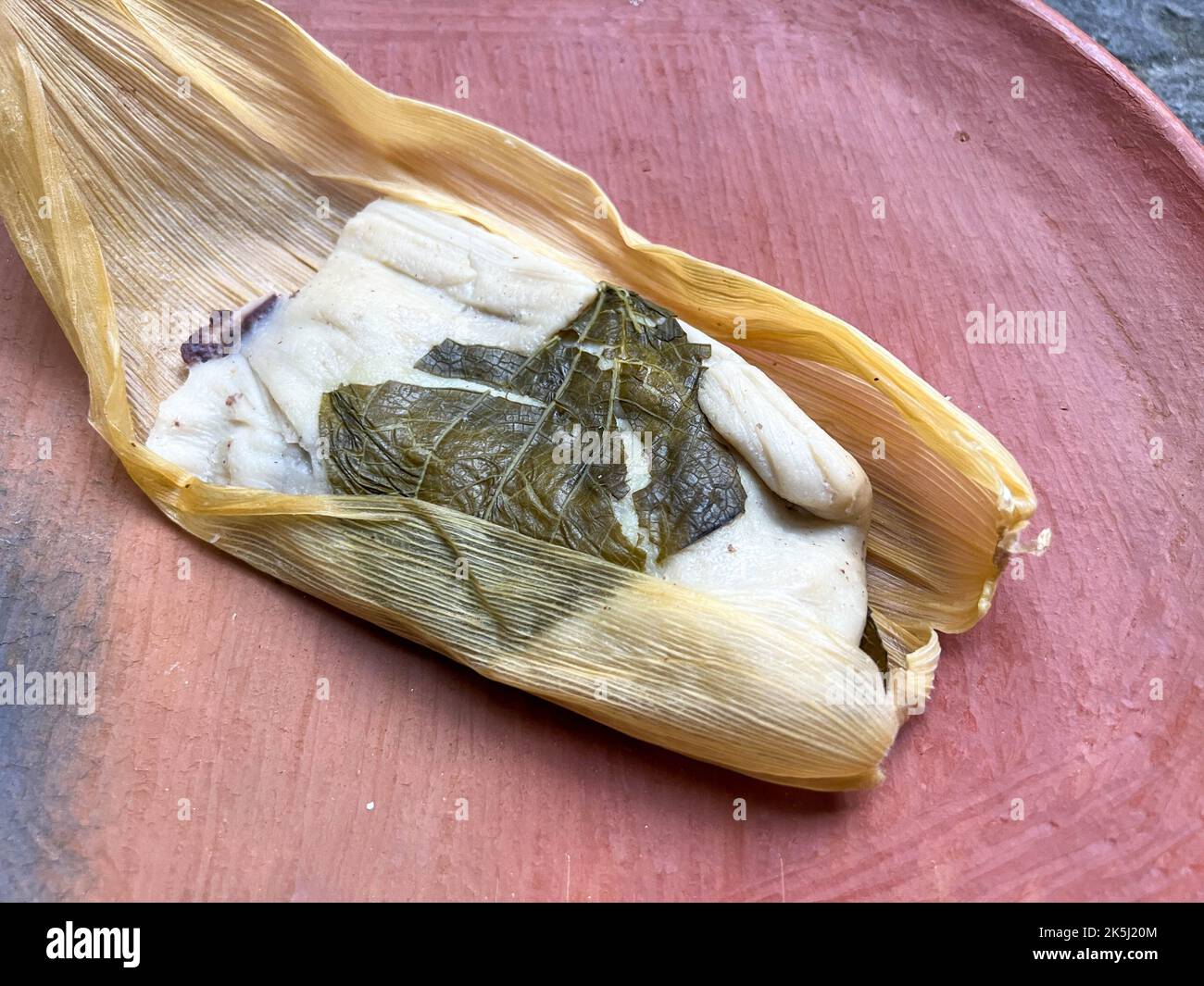 One Oaxacan Tamal on a plate made with masa and hierba santa Stock ...