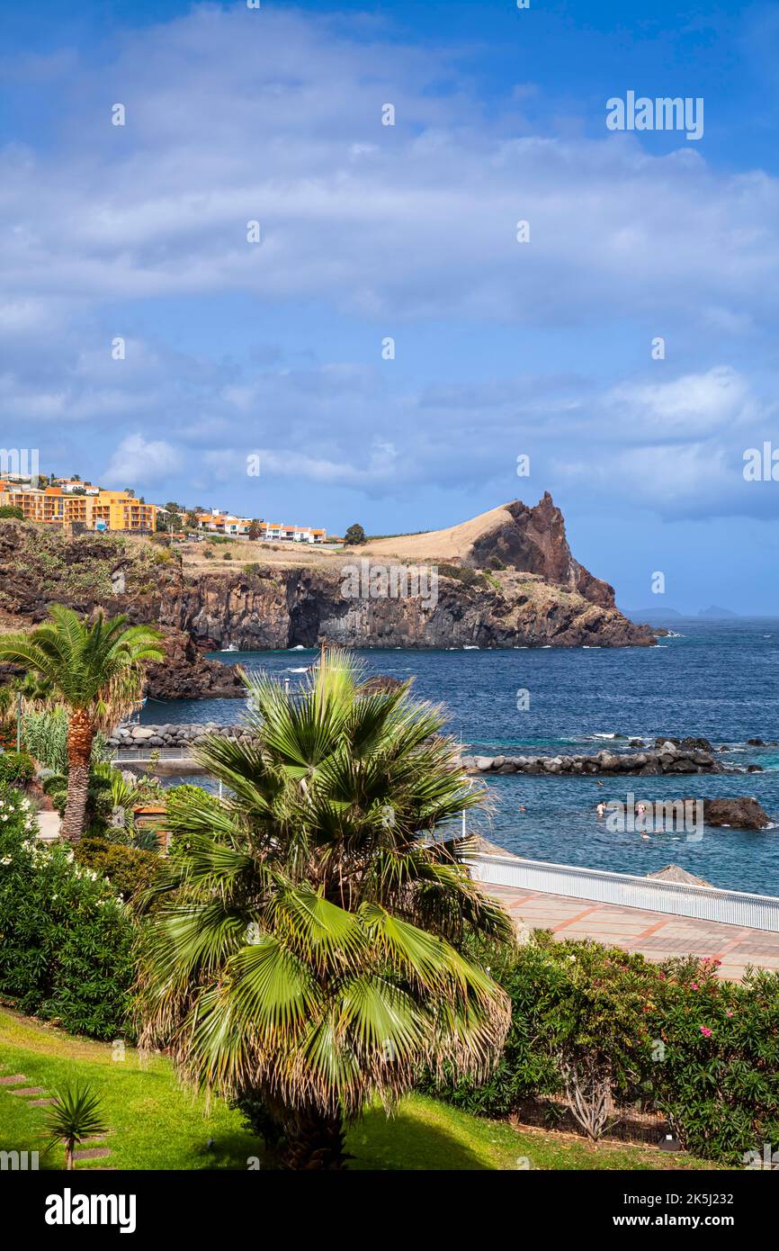 View of the beach promenade and cliffs at Canico, Madeira, Portugal ...