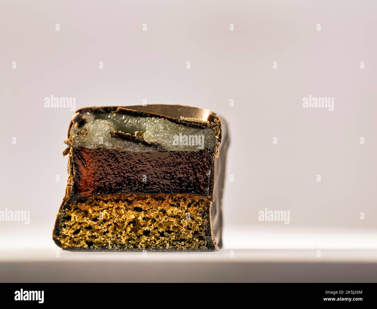 Single halved domino, Christmas sweet with layers of marzipan ...