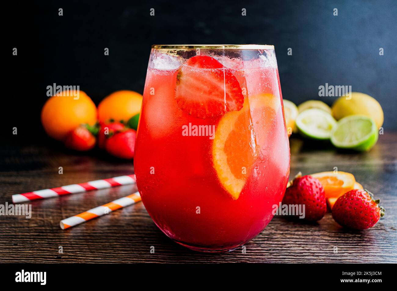 Strawberry Blood Orange Rum Punch with Garnishes and Paper Straws: Rum ...