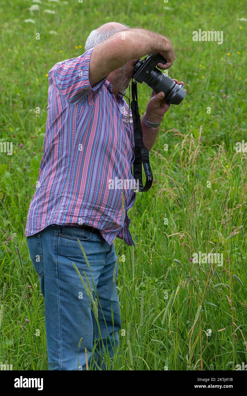 Older gentleman taking a photo, Bavaria, Germany Stock Photo - Alamy