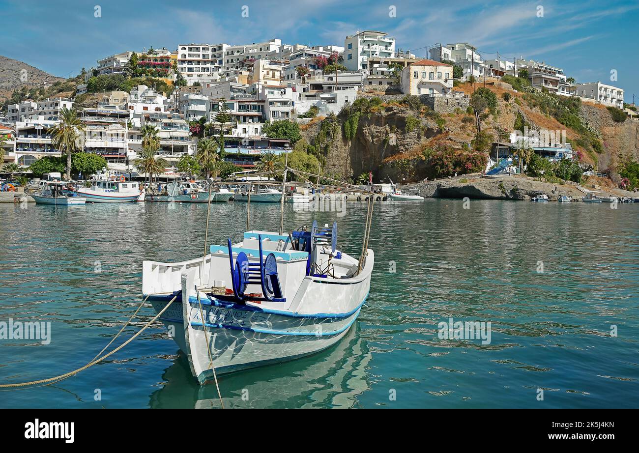 Fishing boat with view of Agia Galini, Crete, Greece Stock Photo - Alamy