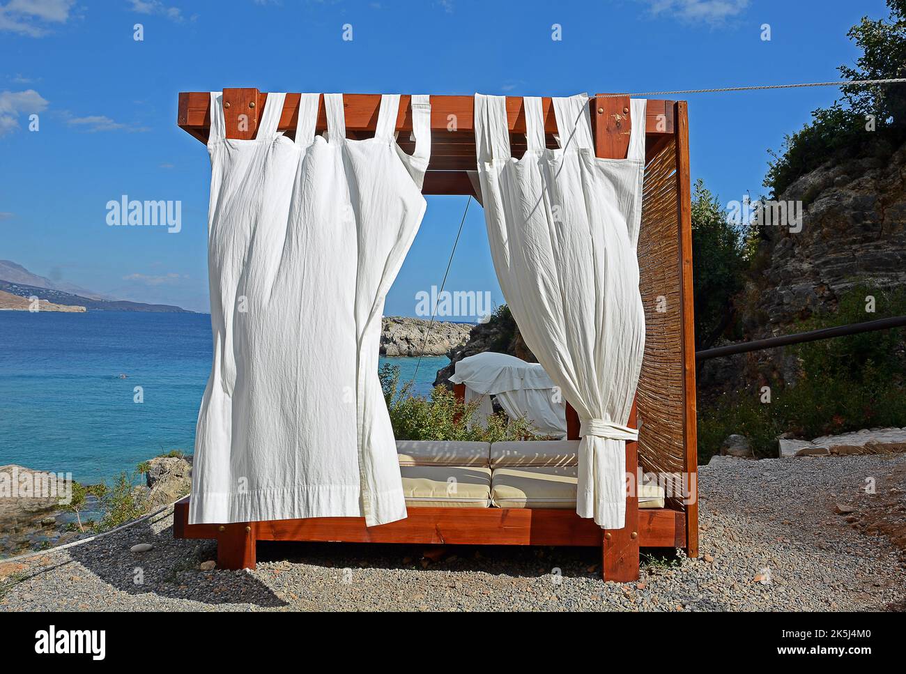 Sun loungers with canopy, Loutro, Crete, Greece Stock Photo - Alamy