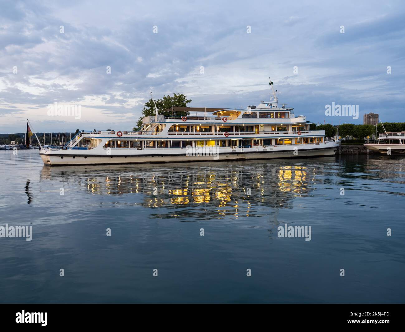 Morning atmosphere on Lake Constance, passenger ship in the harbour of ...