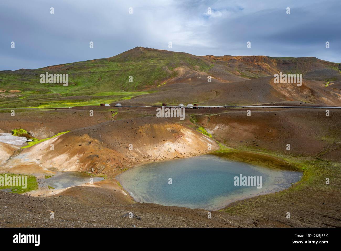Volcanic landscape with colourful hills, pipes of the Krafla geothermal ...