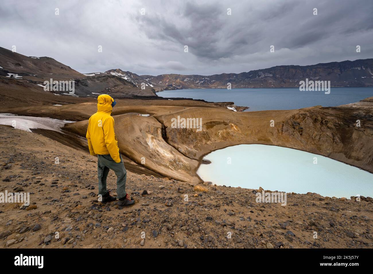 Tourist at the crater rim, crater lake Viti and Oeskjuvatn in the ...