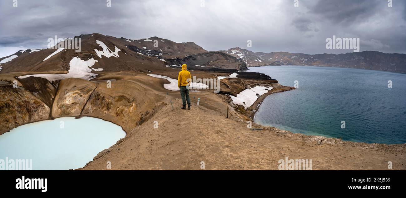 Tourist at the crater rim, crater lake Viti and Oeskjuvatn in the ...