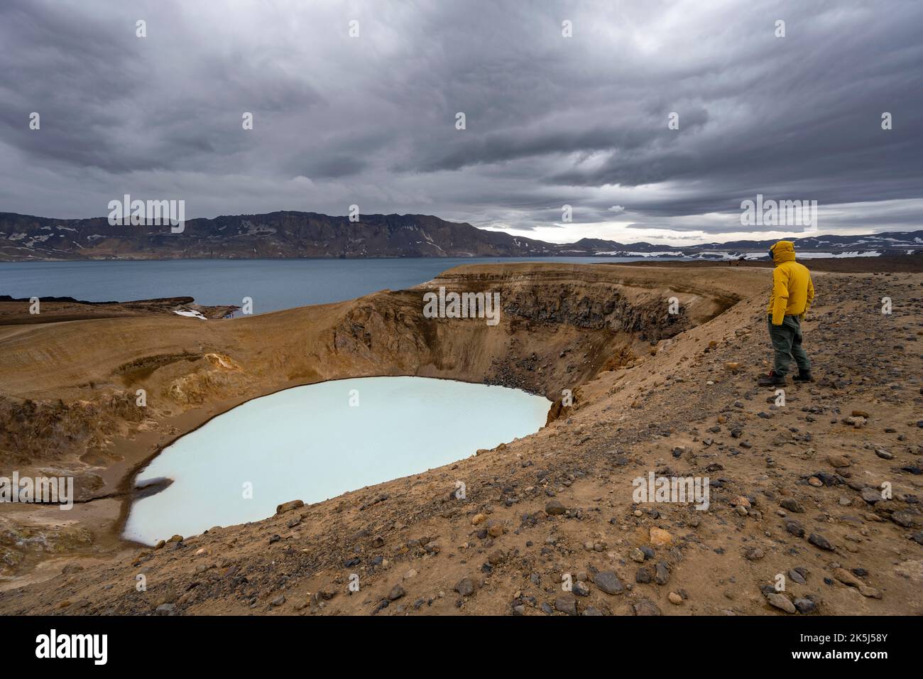 Tourist at the crater rim, crater lake Viti and Oeskjuvatn in the ...