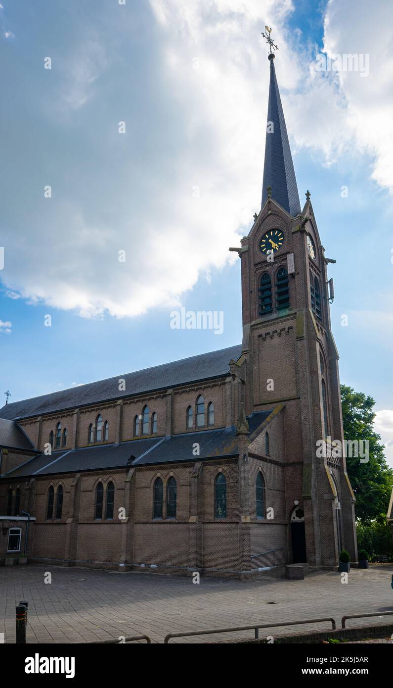 Tall neo-gothic catholic church in the Dutch village of Stompwijk. Name ...