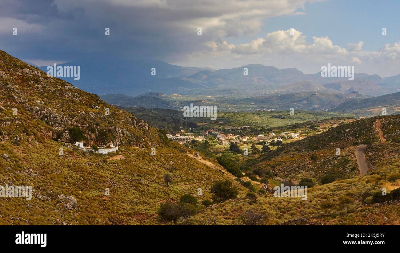 Village of Rodopou, spring, meadows, cloudy blue sky, chapel in the ...
