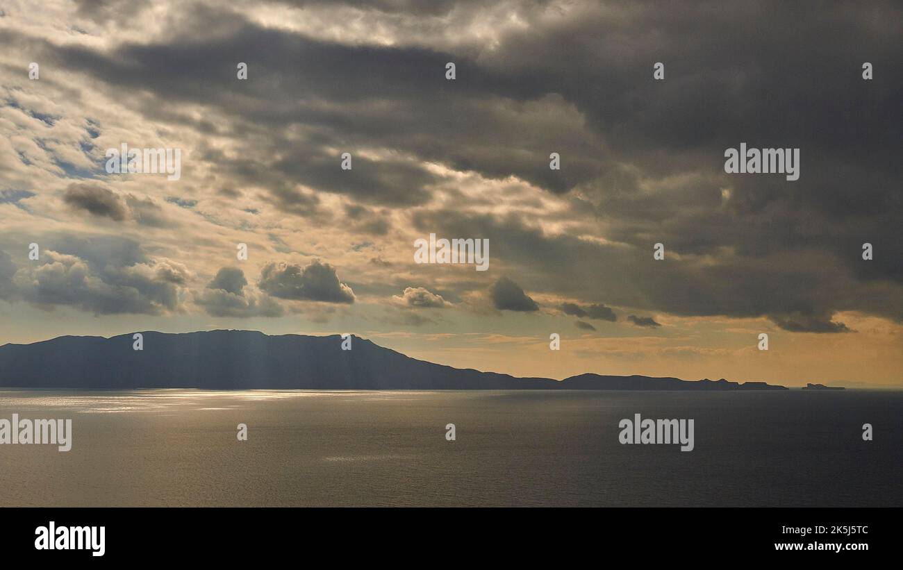 Dramatic cloudy evening sky, sun shreds on the sea, sunset, evening ...