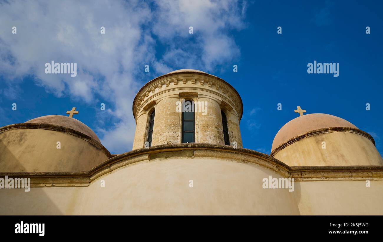 Towers with cross, round tower, ochre building, wide angle, blue sky ...