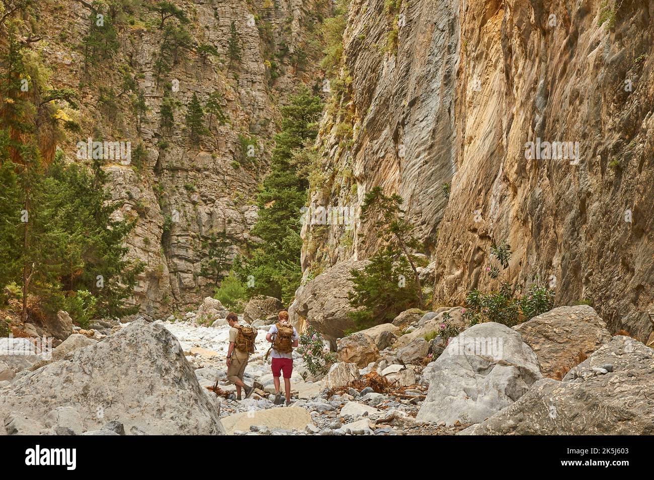 Hiking trail, two hikers with backpacks from behind, Samaria Gorge ...