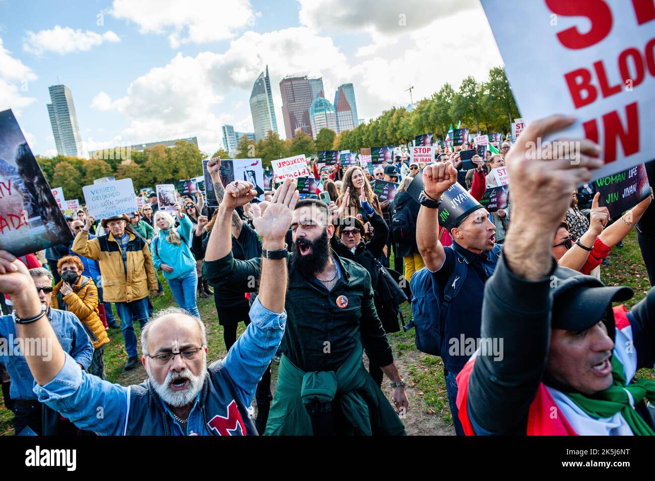 Iranian men are seen very angry while shouting slogans during the rally ...