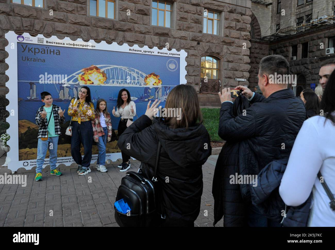 People take photos against the background of the stamp layout, which ...