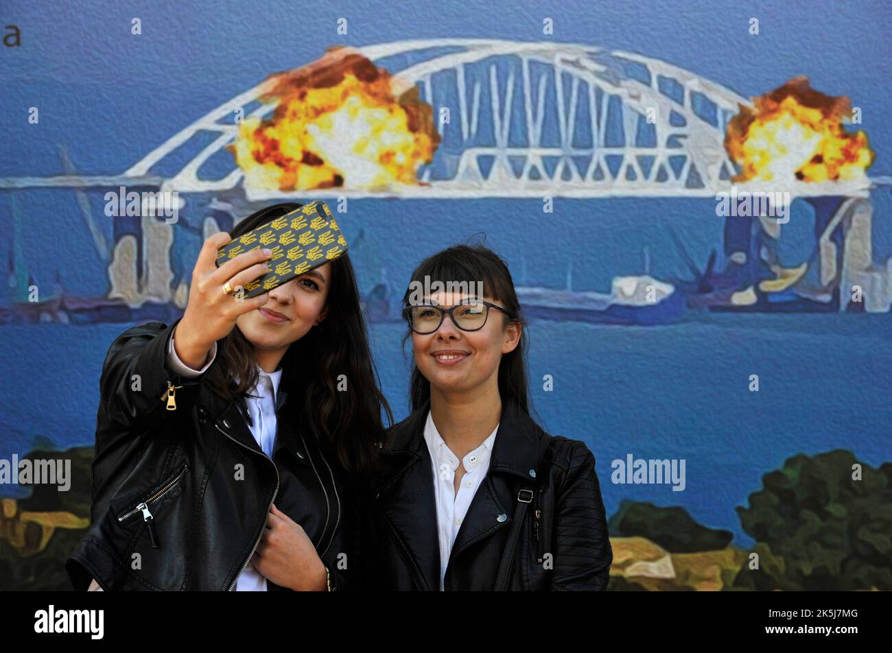 People take photos against the background of the stamp layout, which ...