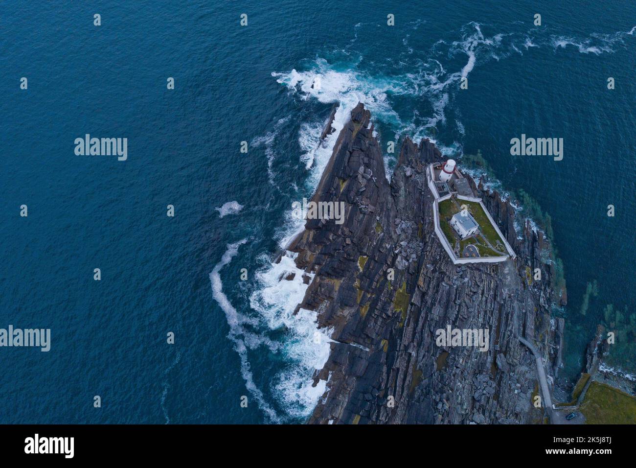 Aerial view, coast and cliffs with lighthouse, Valentia Island ...
