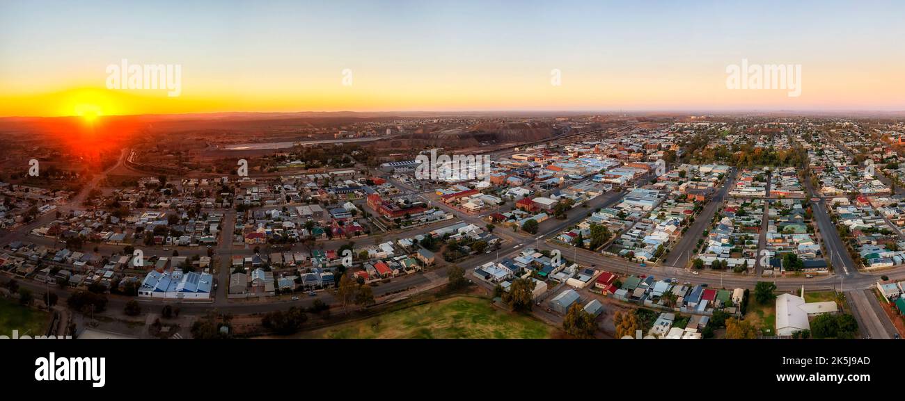 Scenic mid-air sunrise panorama over Broken hill city from sun horizon ...