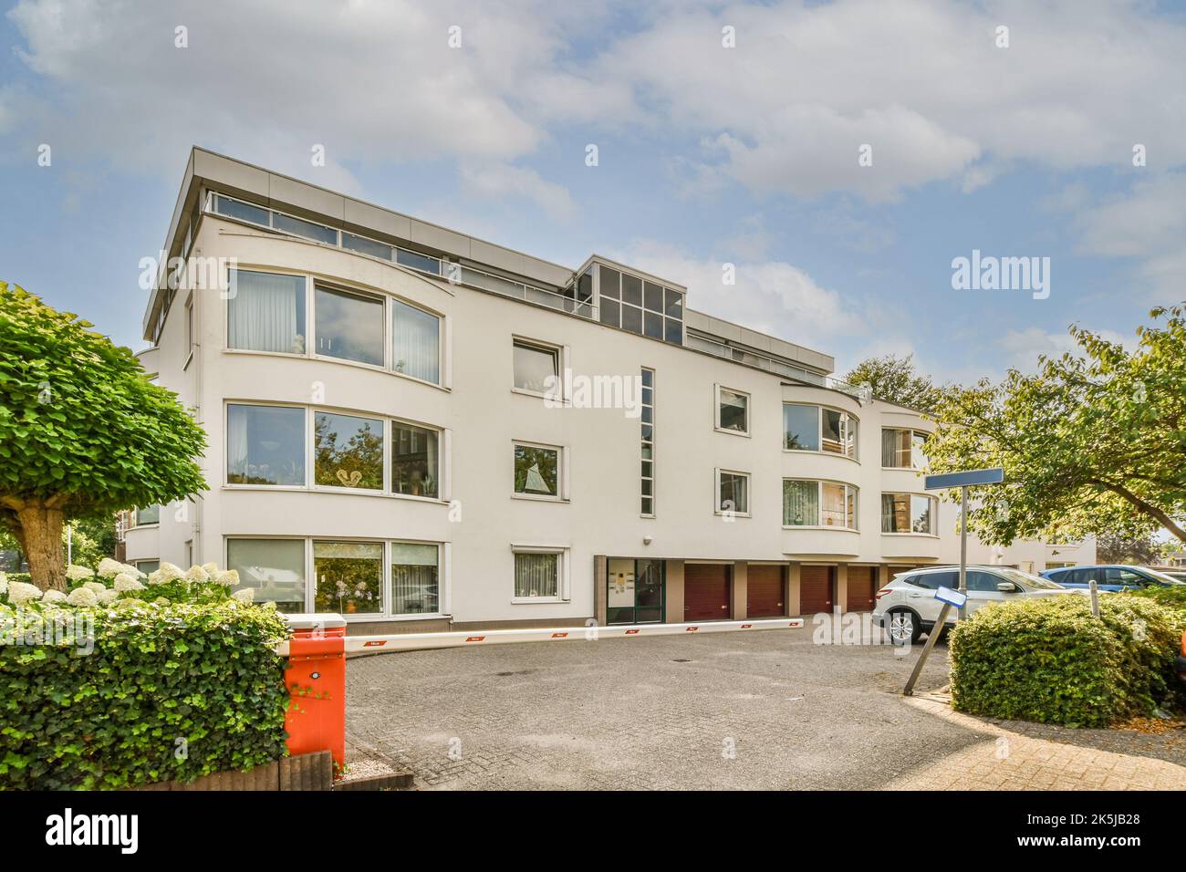 View of street near building with beauty of vegetation outside Stock ...