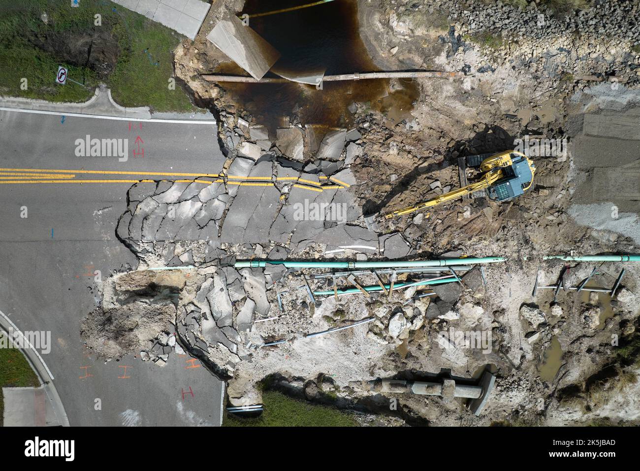 Aerial view of reconstruction of damaged road bridge destroyed by river ...