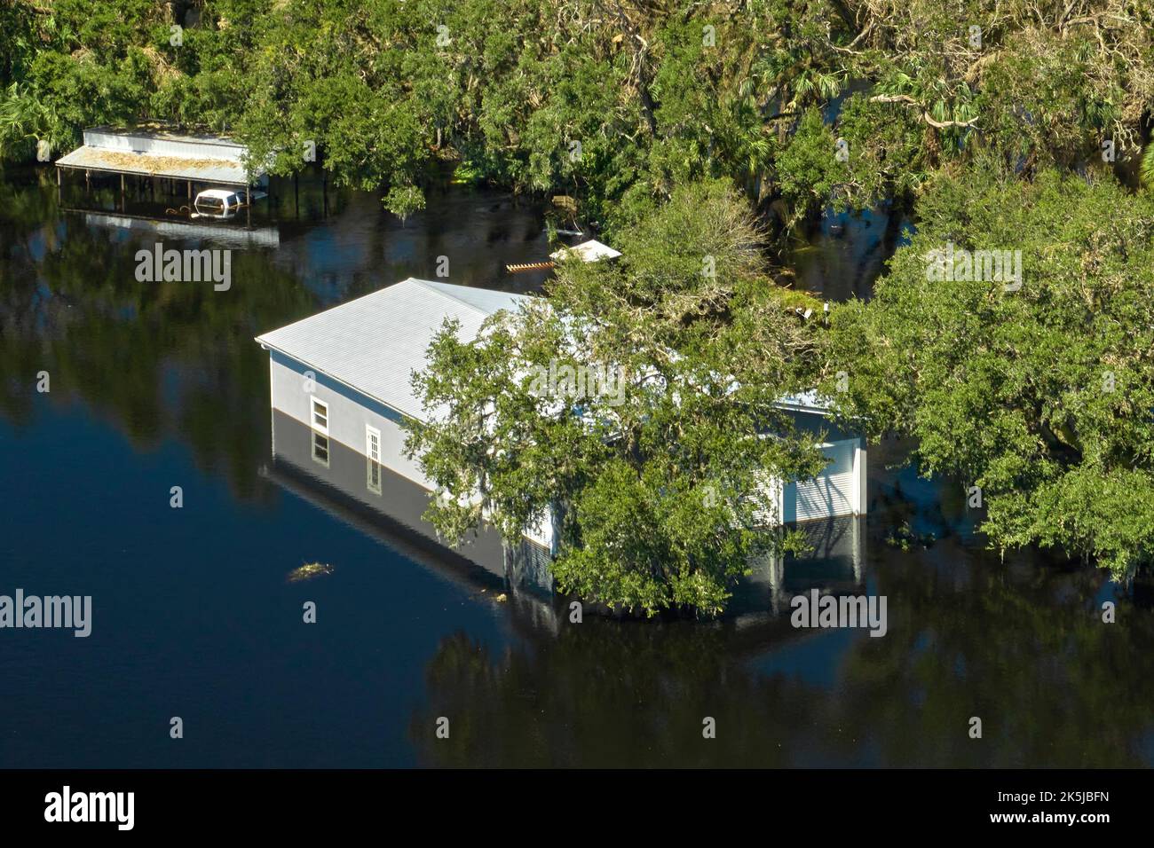 Flooded house by hurricane Ian rainfall in Florida residential area ...