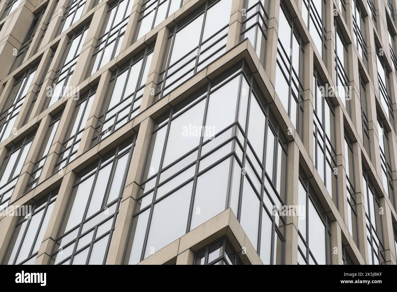 Facade of modern high-rise building with glass windows. Texture of ...