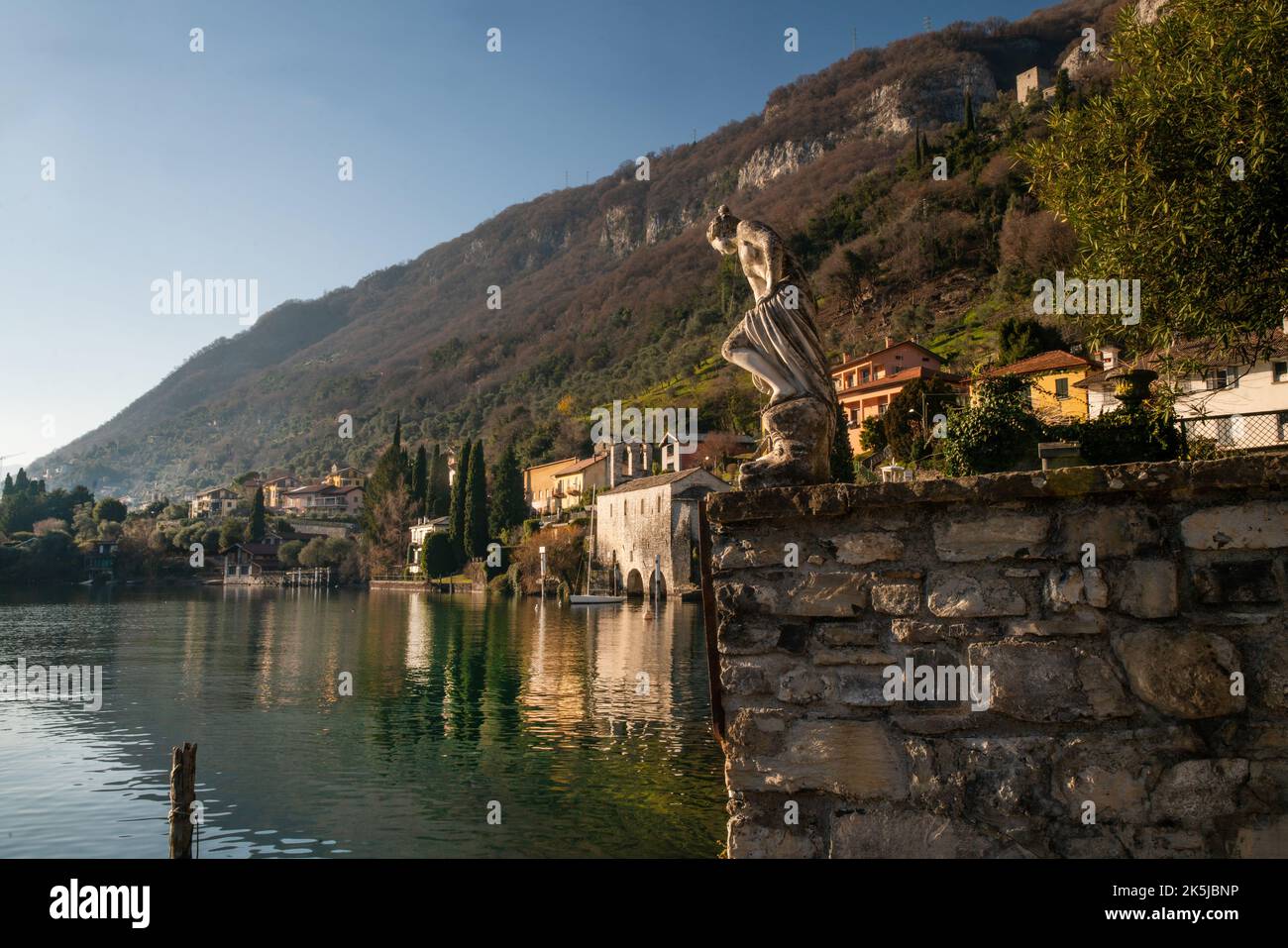 An old statue and a stunning view of the village of Sala Comacchino on ...