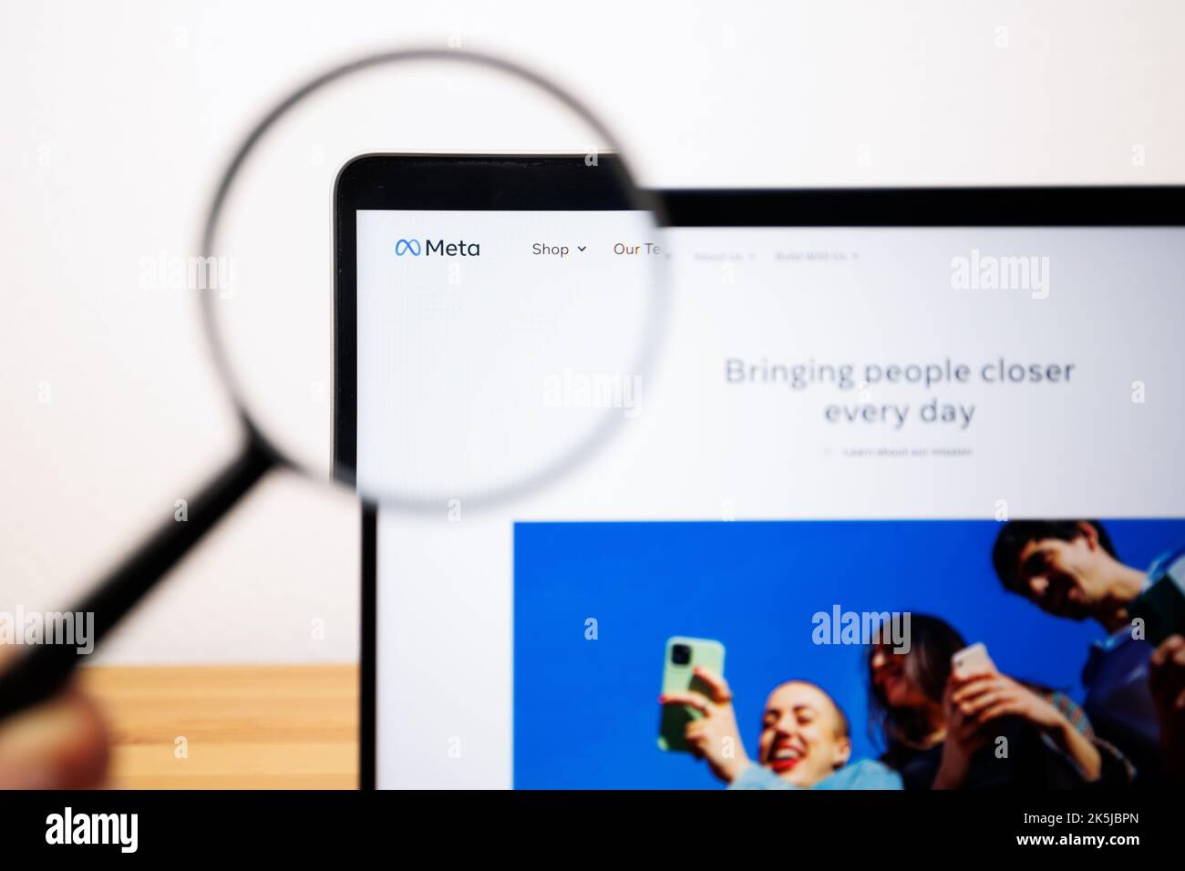 The logo of Meta on a laptop desktop under a magnifying glass Stock ...