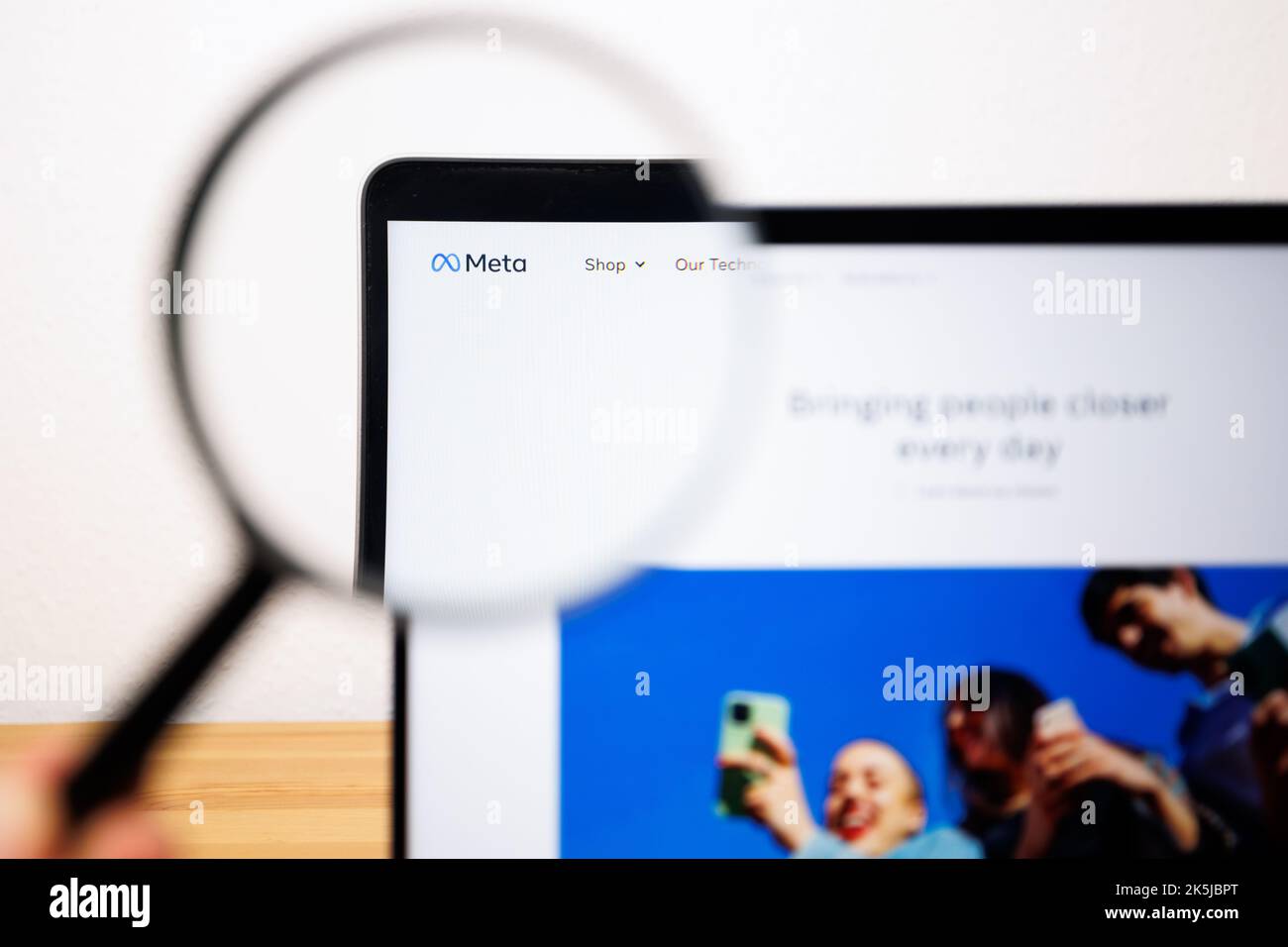 The logo of Meta on a laptop desktop under a magnifying glass Stock ...