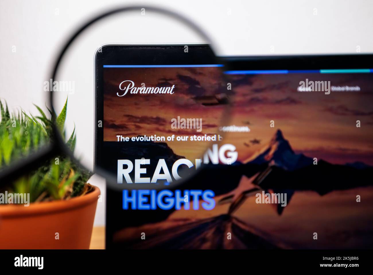 The logo of Paramount on a laptop desktop under a magnifying glass ...