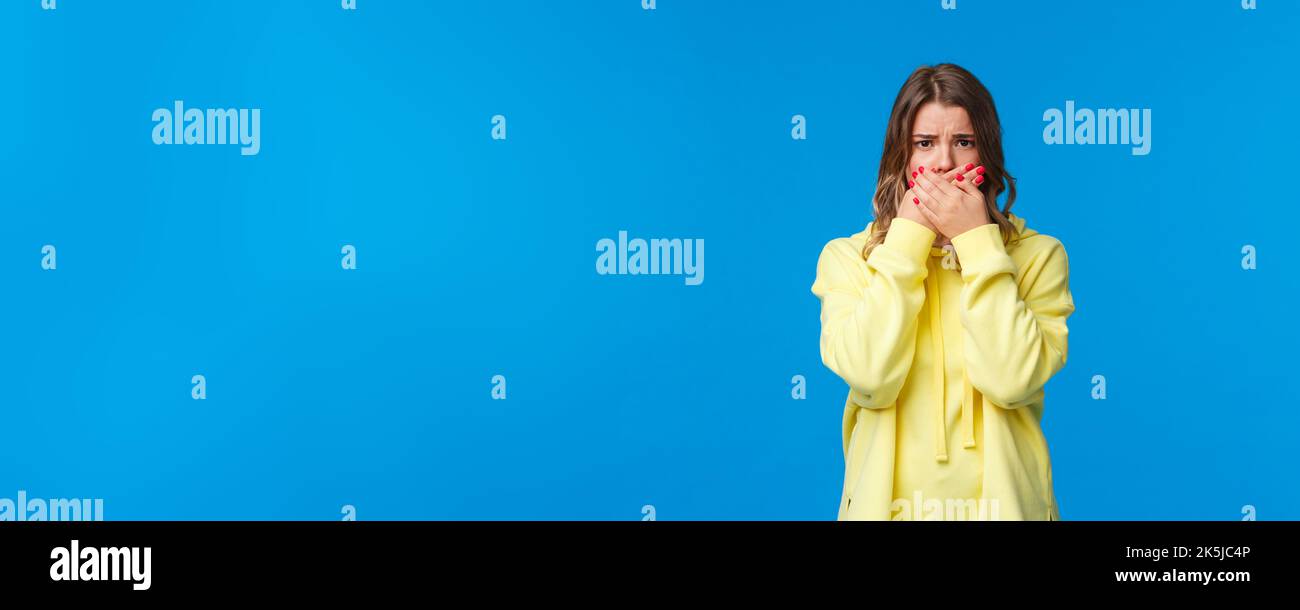 Upset and uneasy cute gloomy teenage girl have pimple near lip, cover ...