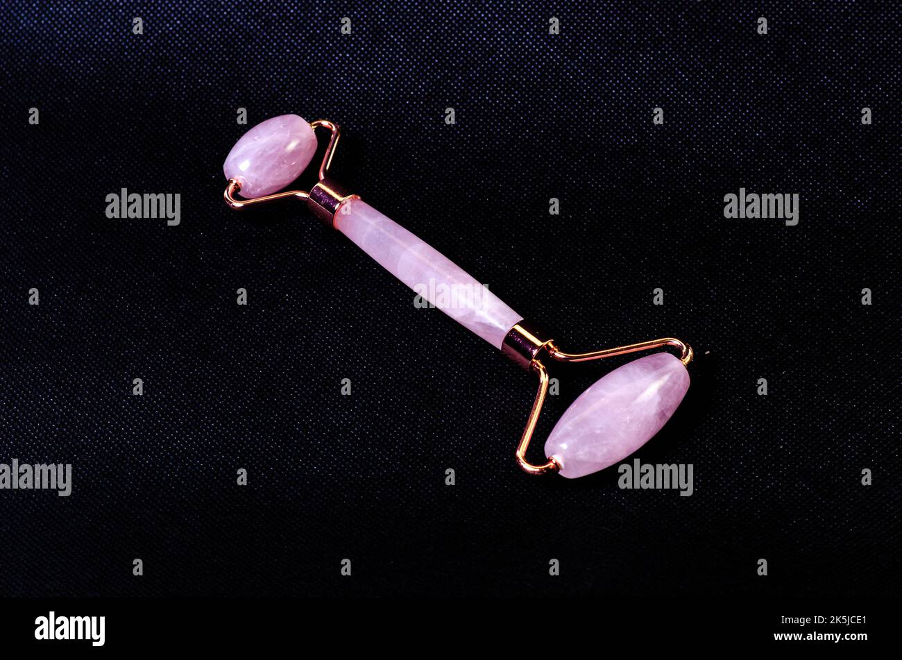 Rose Quartz Facial Roller And Massage Stone Gua Sha Isolated On White